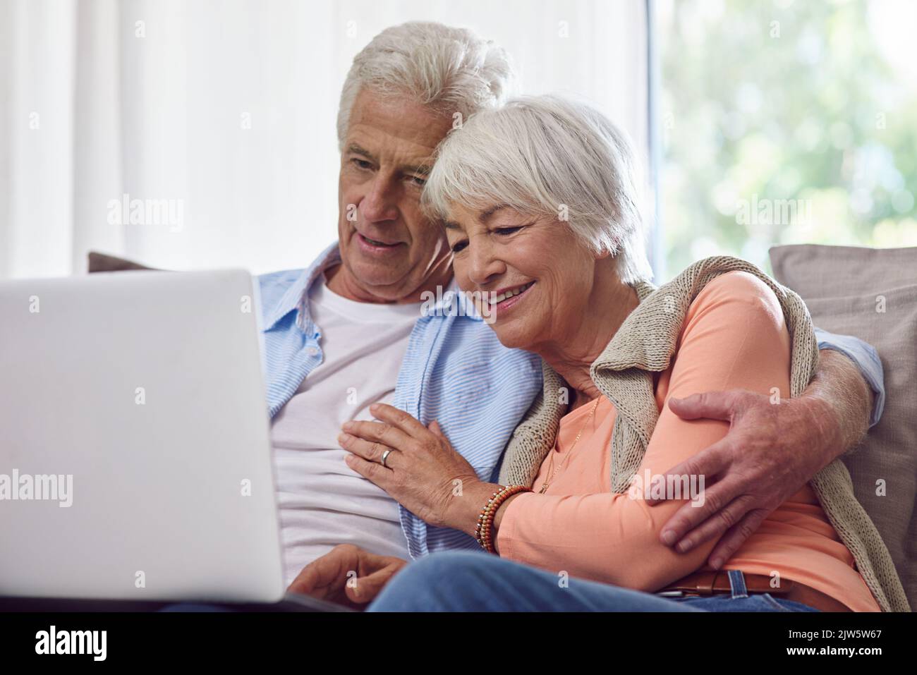Online movie time is our favorite time of the day. a senior couple ...