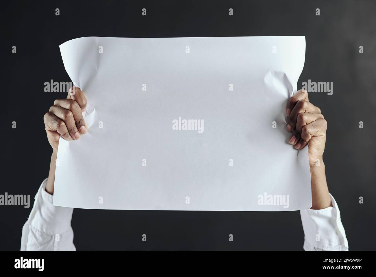 Hand holding blank page hi-res stock photography and images - Alamy