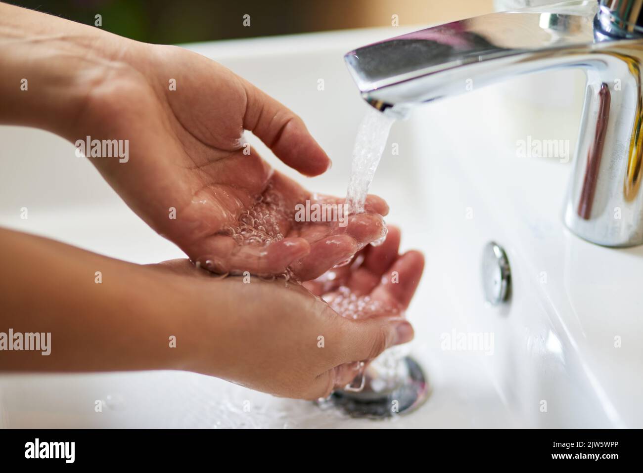 Staying clean and fresh. a hands being washed at a tap Stock Photo - Alamy