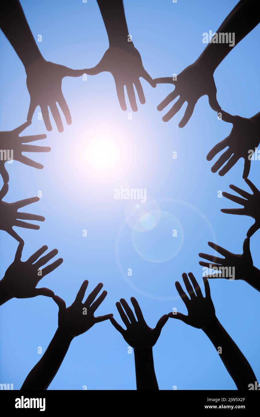 People Holding Hands Together In A Circle