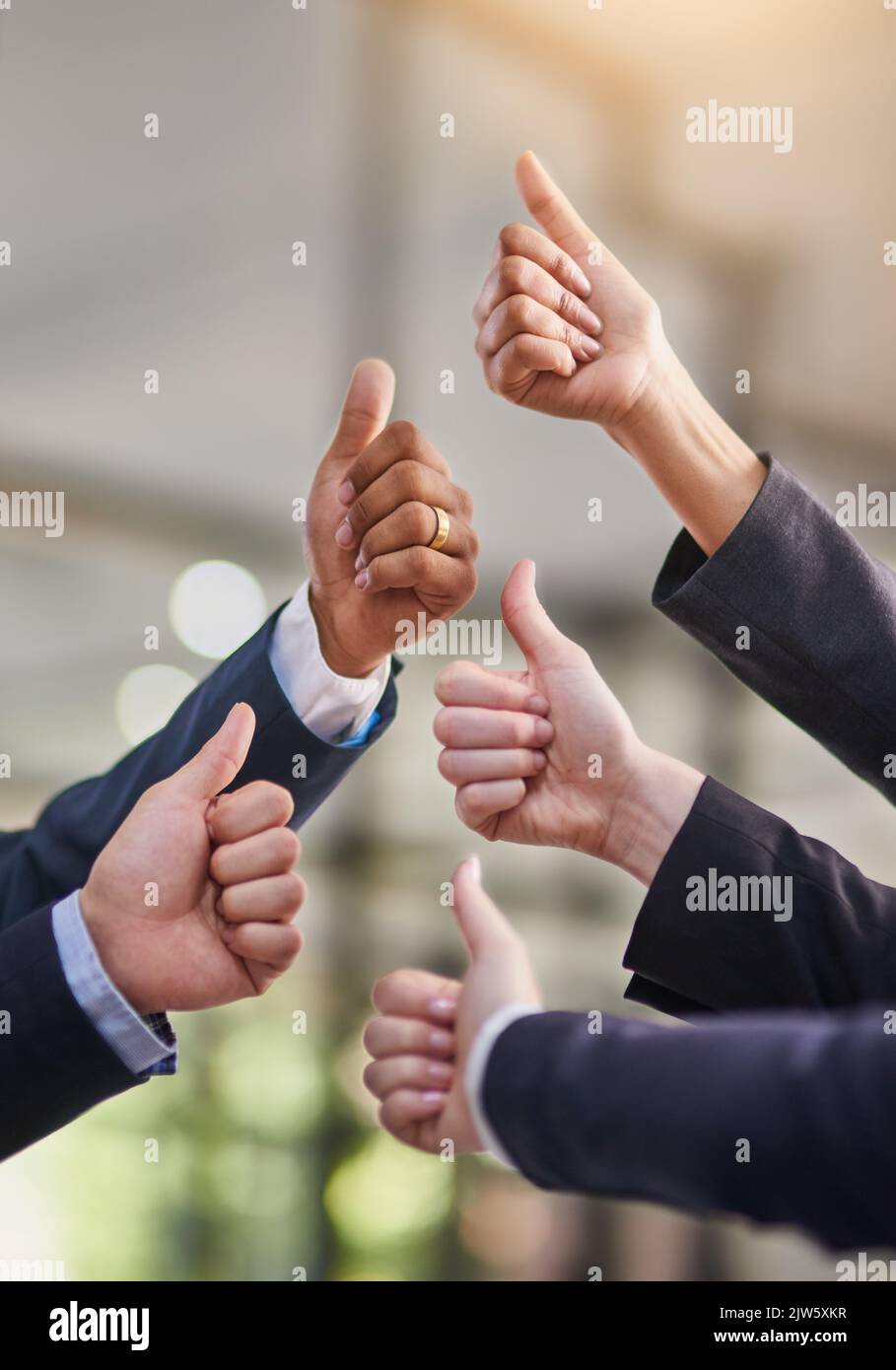 Superb work. a group of office workers giving thumbs up together Stock ...