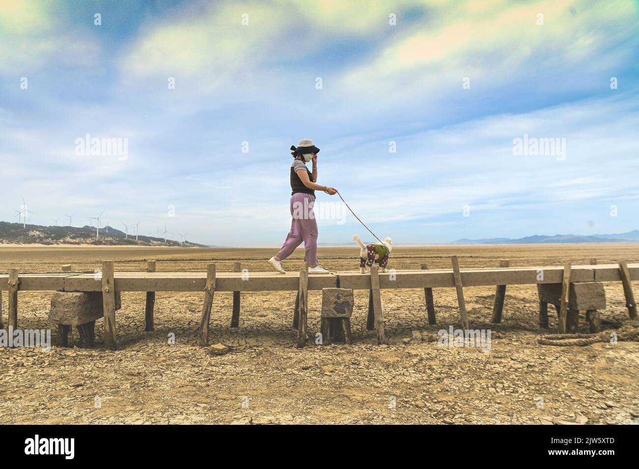 JIUJIANG, CHINA - SEPTEMBER 3, 2022 - Tourists walk on the exposed ...