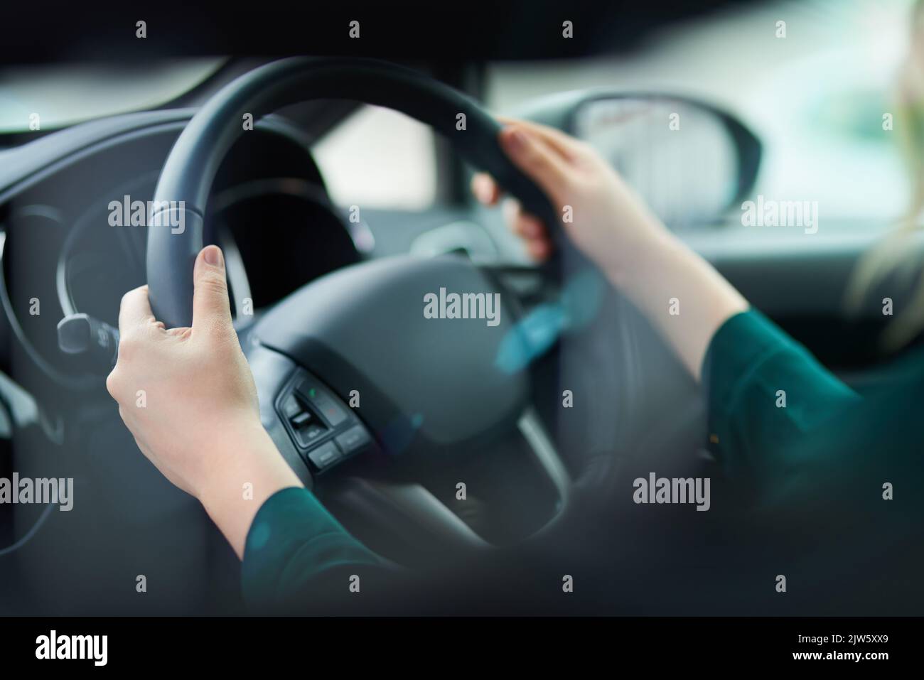 Woman driver holding steering hi-res stock photography and images - Alamy