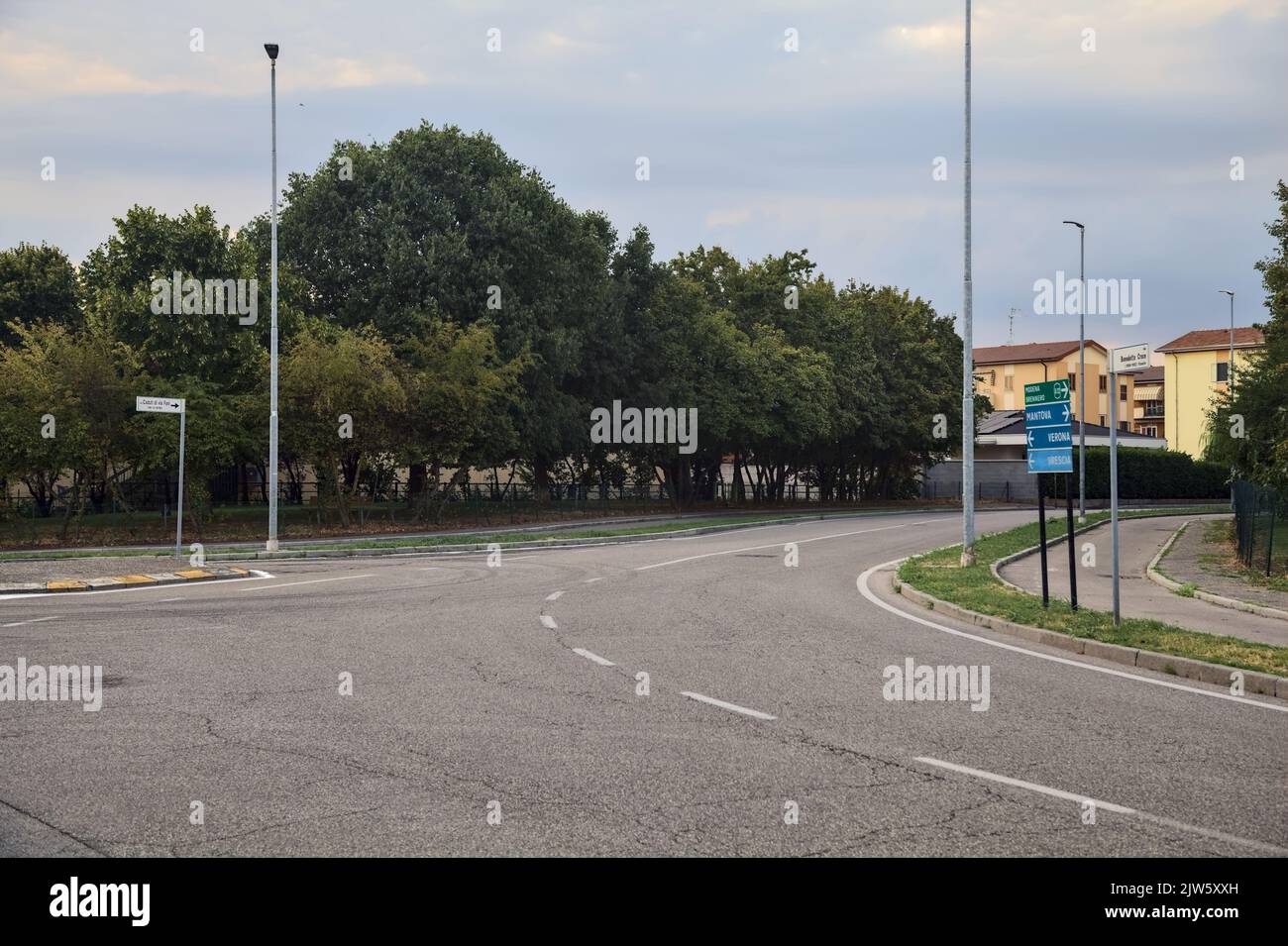 Road in a village in the italian countryside at sunset Stock Photo - Alamy