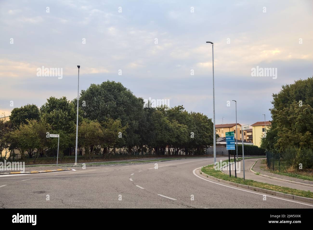 Road in a village in the italian countryside at sunset Stock Photo - Alamy