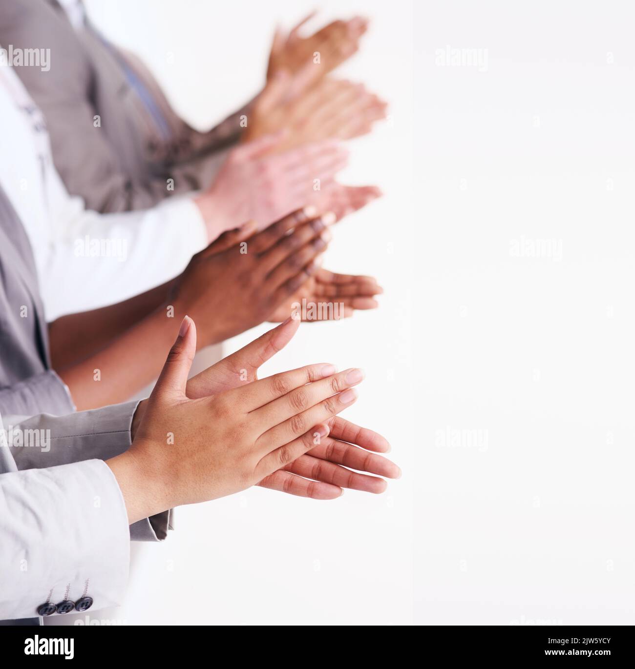 Well done. a group of people clapping their hands together Stock Photo ...