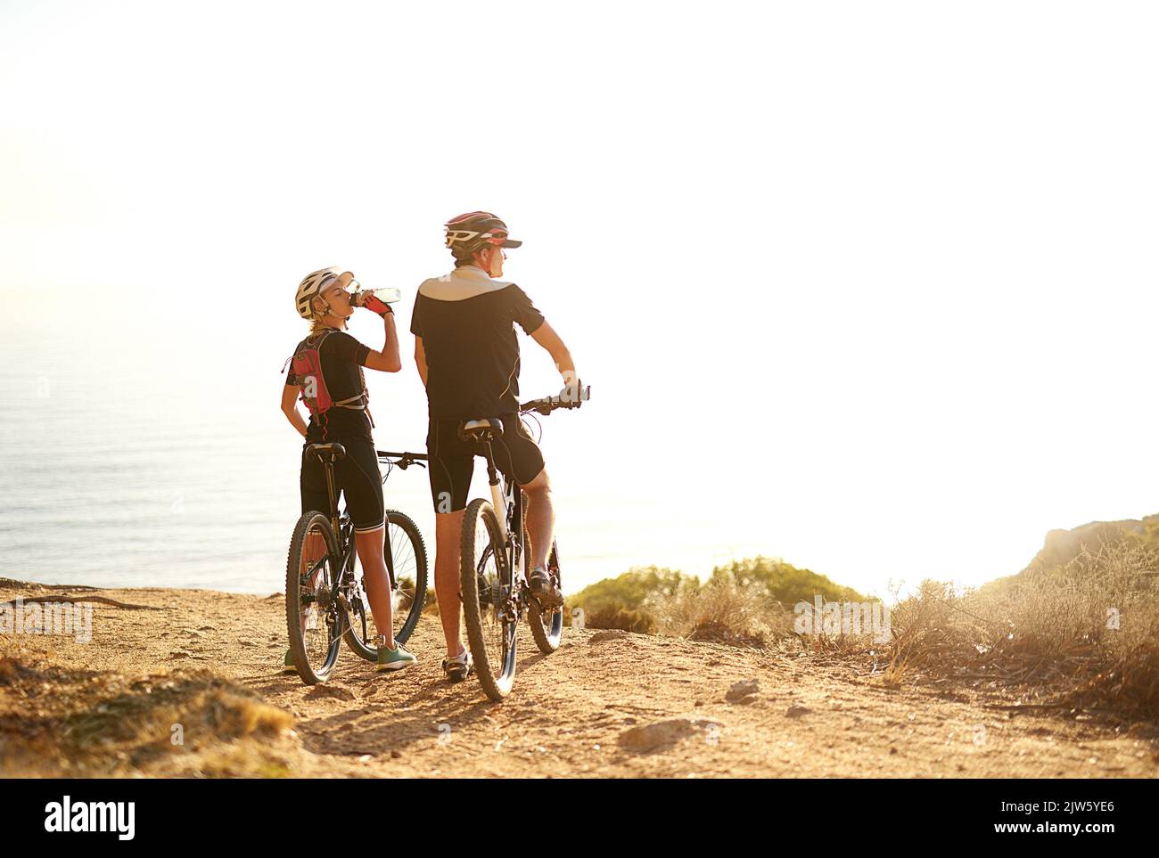 The ride is tough but the view is great. a young couple admiring the ...
