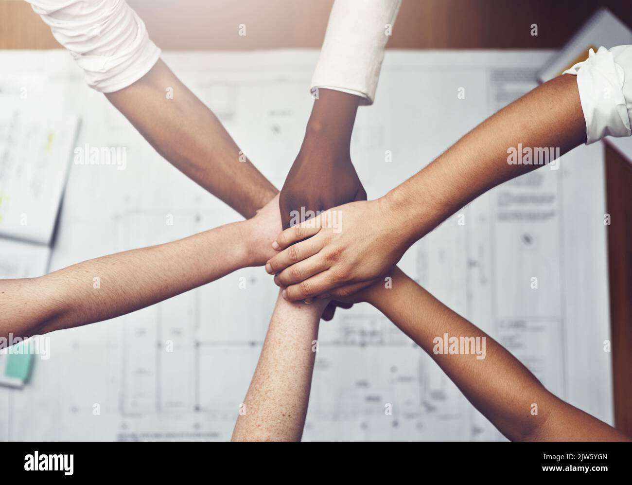 We all work together in perfect harmony. unrecognizable businesspeople ...