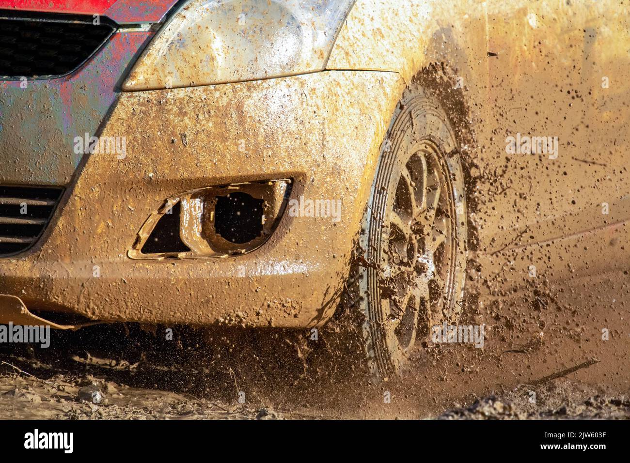 Car stuck in mud during construction of main road Stock Photo - Alamy