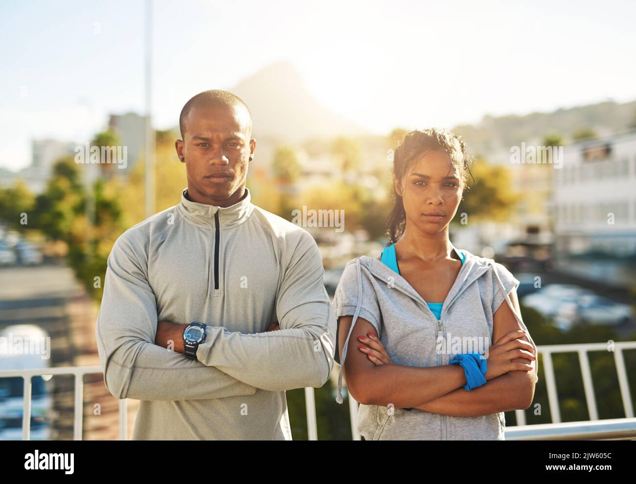 Conquer the challenge. a young sporty couple out for a workout Stock ...