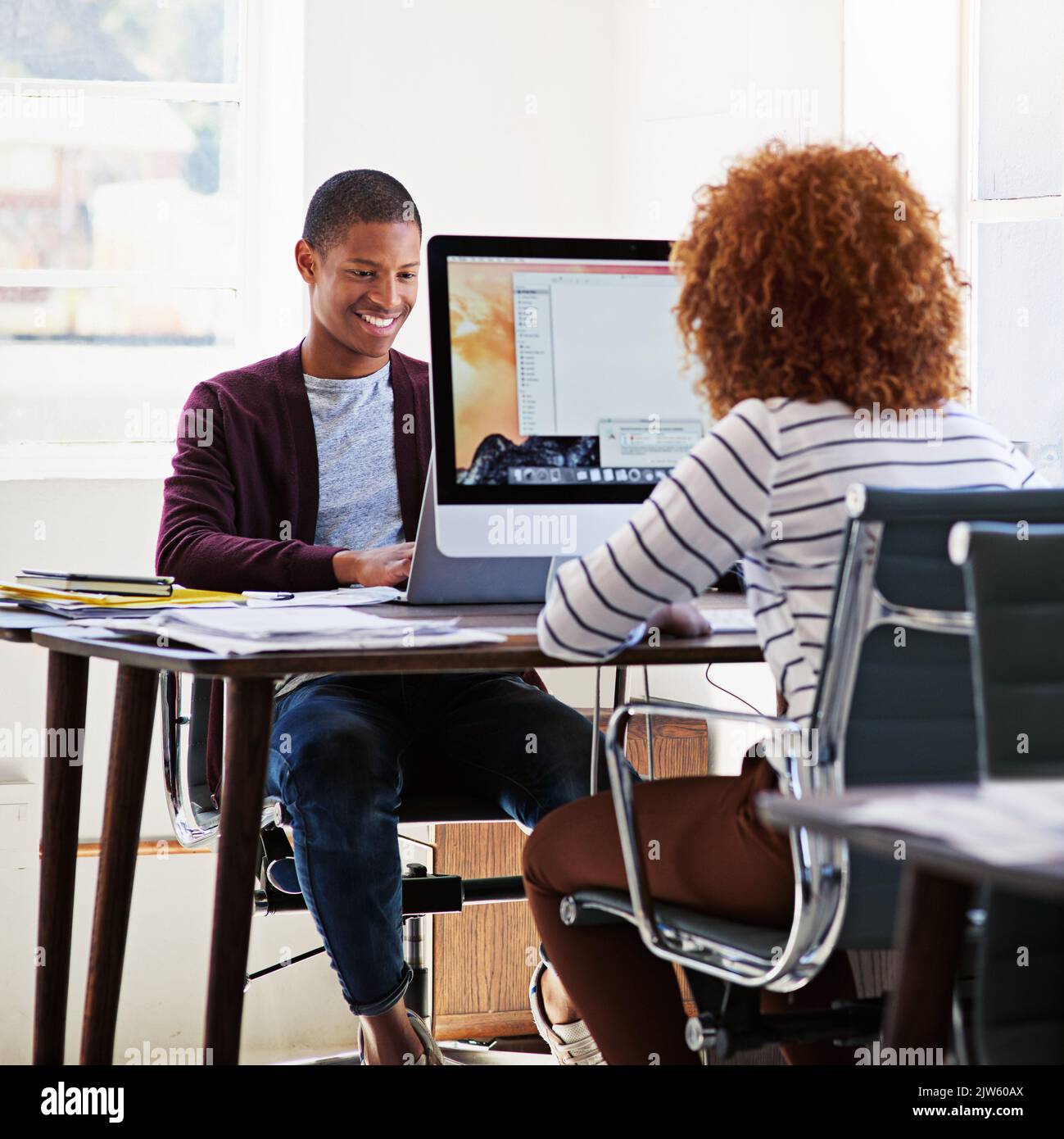 Business is what they do best. colleagues working on their computers in ...