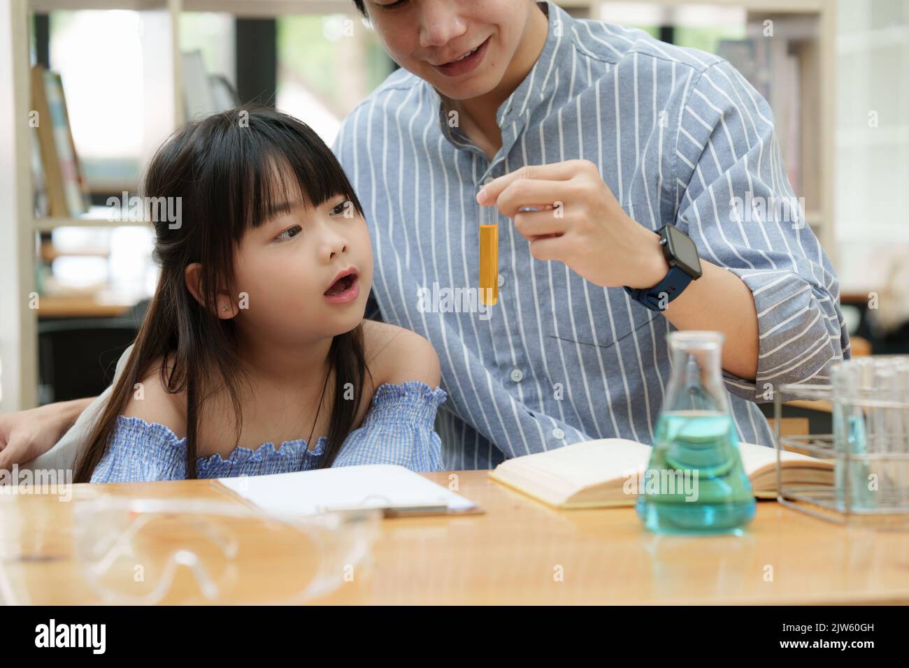 Kid and father doing science experiments. Education science concept ...
