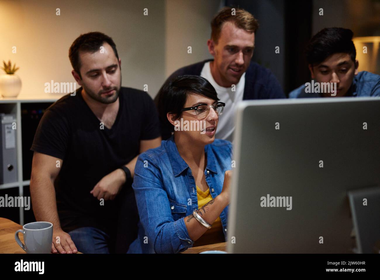 Theyre all on set on productivity. employees working in an office at ...