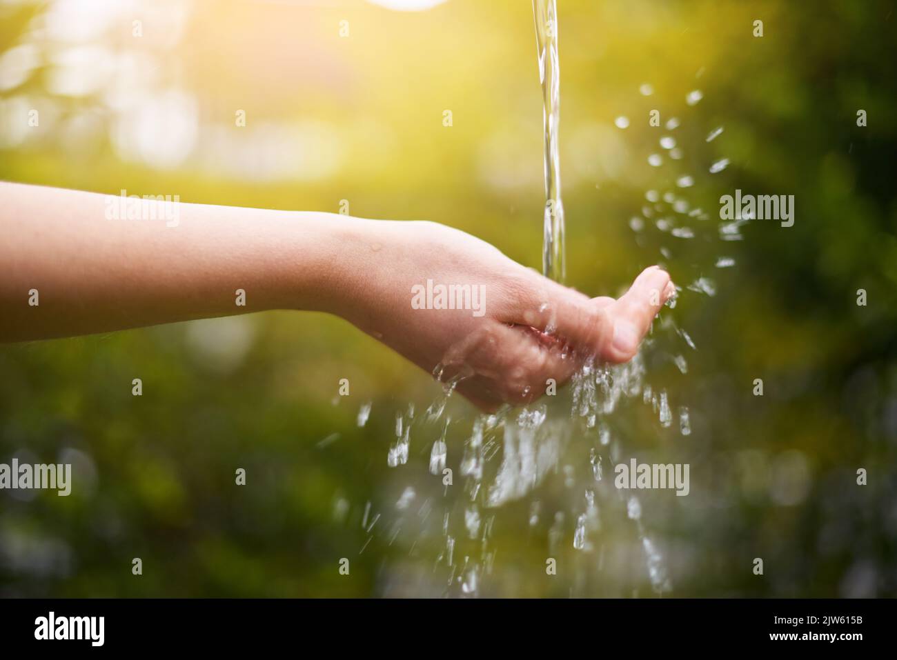 Water is such a precious commodity. hands held out to catch a stream of ...
