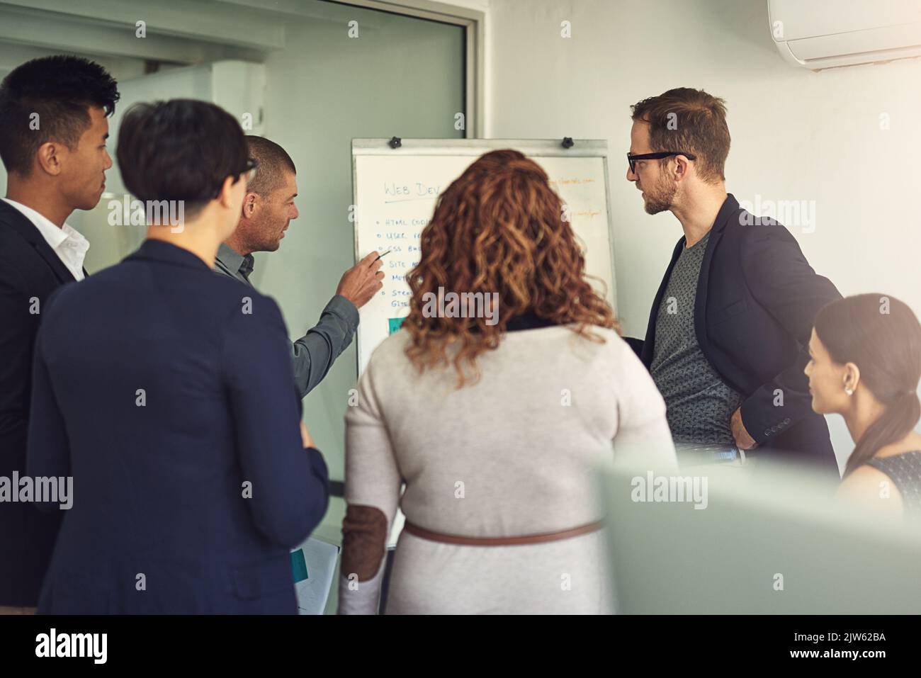 Everyone has something to offer. a young man giving a presentation to ...