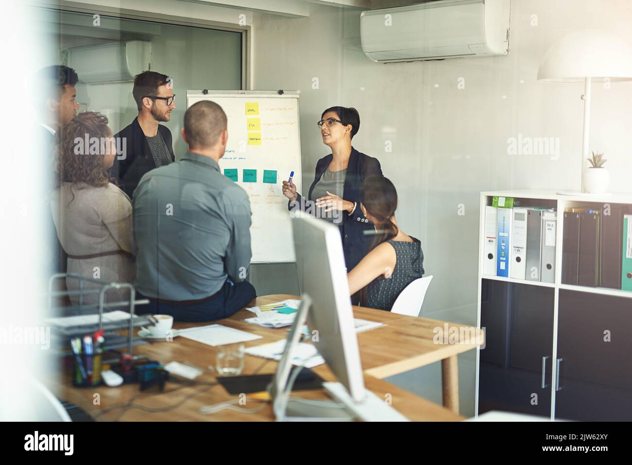 Streamlining her teams workflow. a presentation in progress in a modern ...