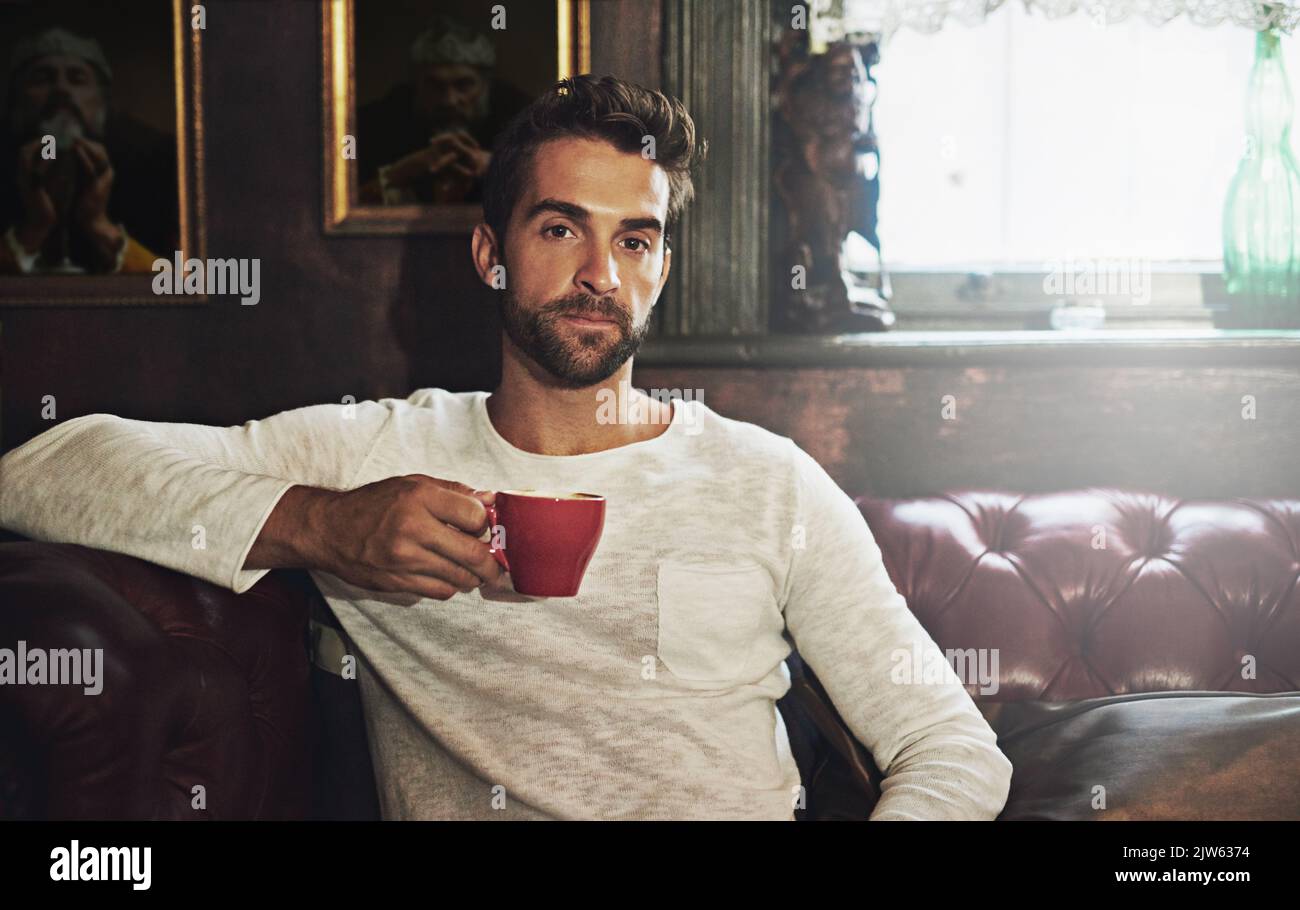 Time to kick back with a cuppa joe. Portrait of a handsome man having a ...