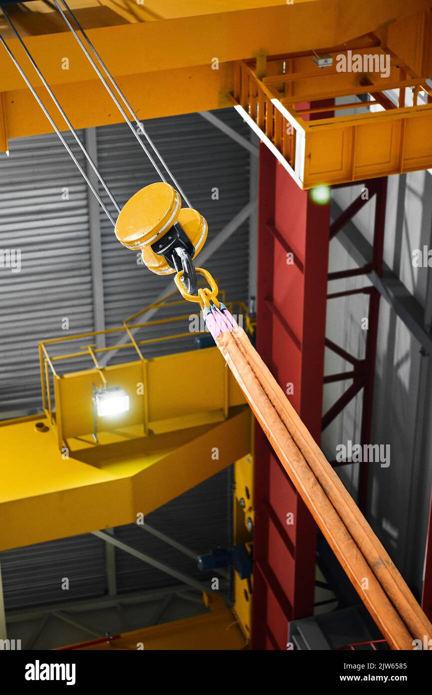 Hook assembly with rigging and strops of moving crane Stock Photo - Alamy