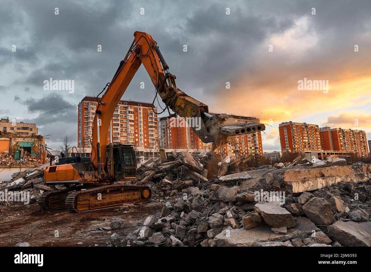 Excavator with concrete crusher on rig at demolition site Stock Photo ...
