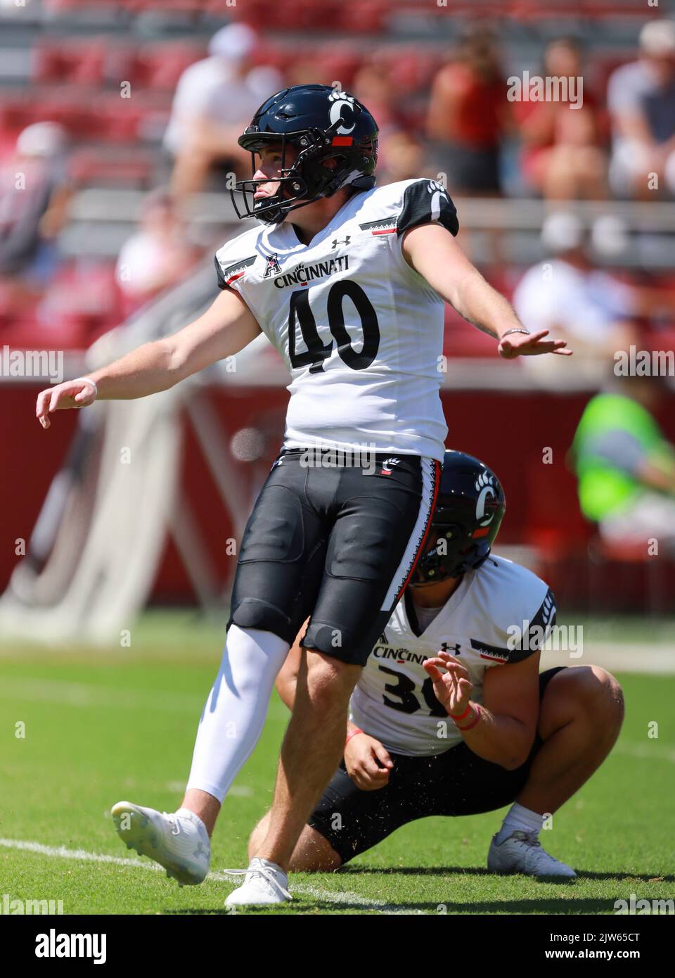 September 3, 2022: Cincinnati place kicker Ryan Coe #40 watches to see where a ball ends up that ...