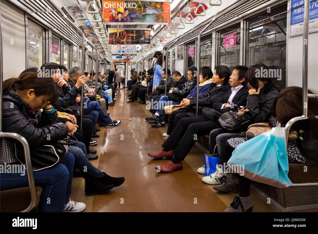 Passengers interior subway train Tokyko Japan Stock Photo - Alamy