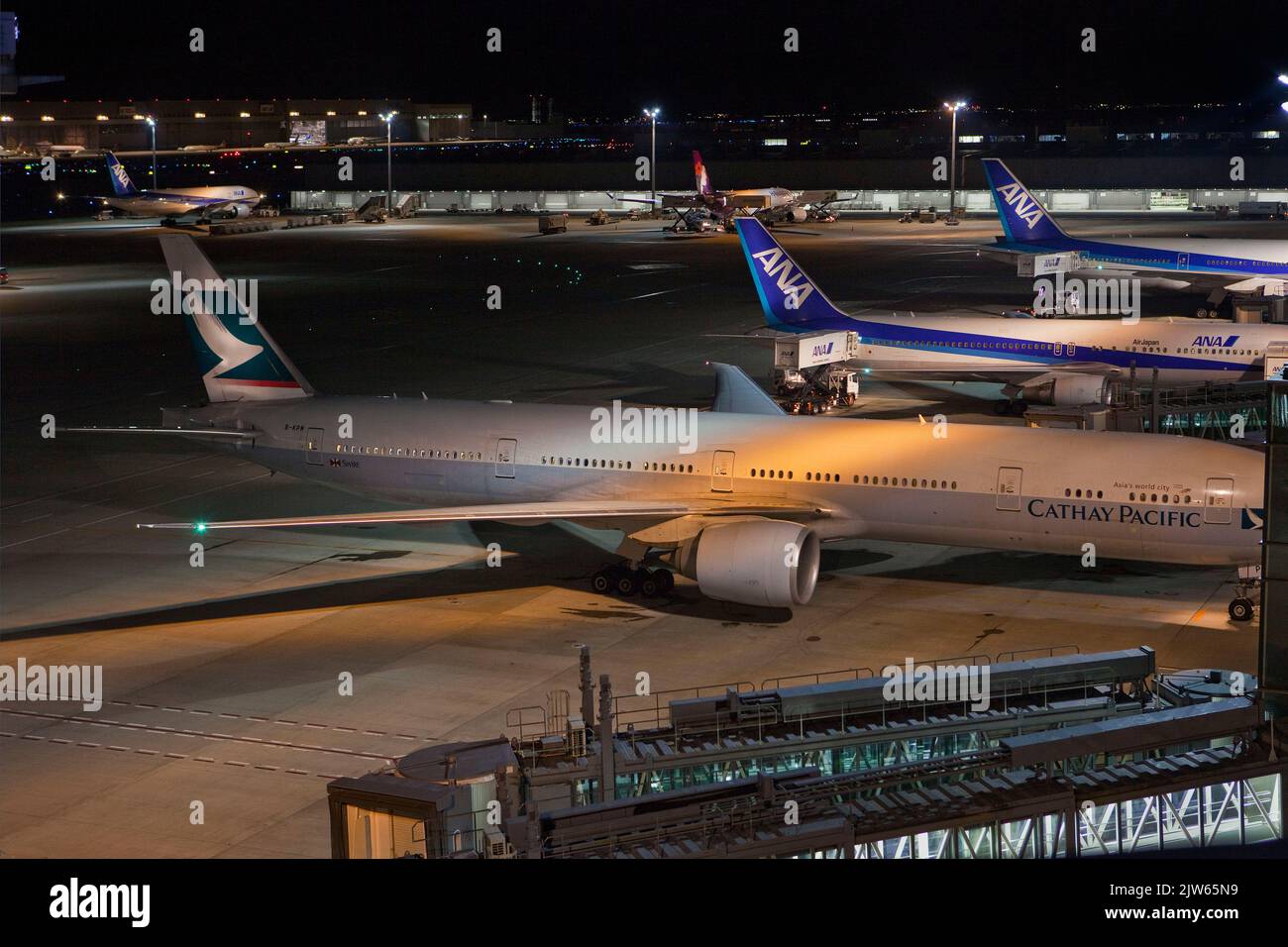 Planes serviced at gates night Haneda Airport Tokyo Japan Stock Photo ...