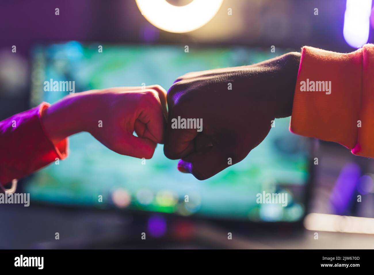 Close-up shot of two online game players celebrating victory in ...