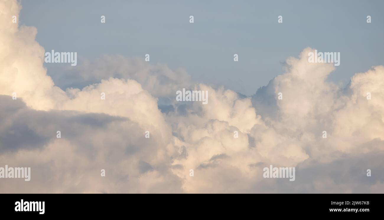 Puff Clouds in the Sky during sunset Stock Photo - Alamy