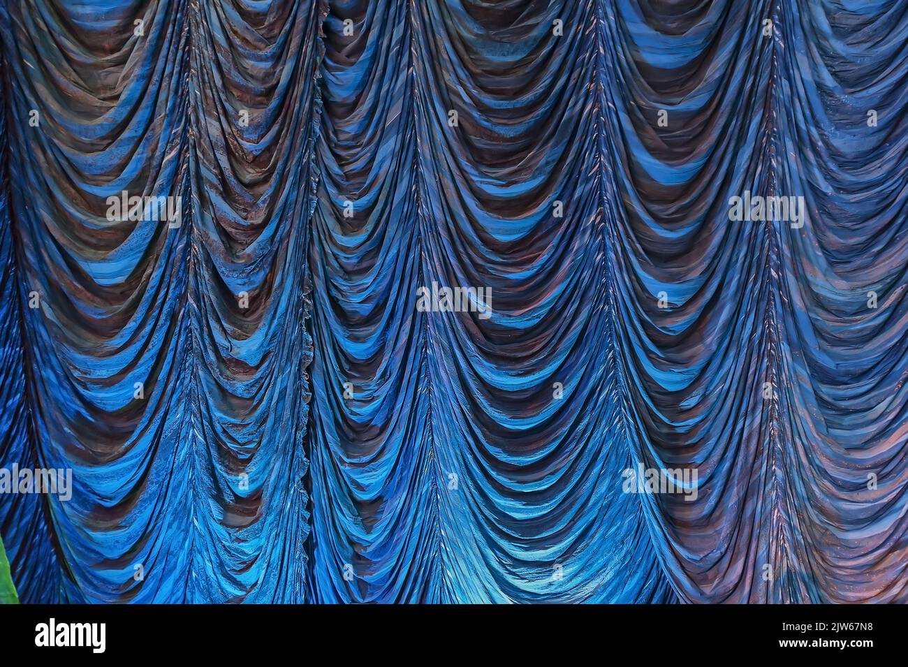 Austrian pleated main front stage curtain with blue highlight Stock ...