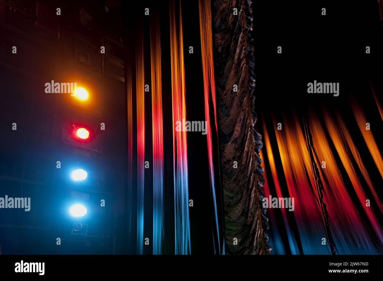Austrian pleated main front stage curtain under the light of colorful ...
