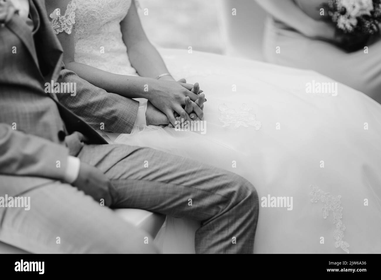 Bride and Groom holding hands during their wedding ceremony Stock Photo ...