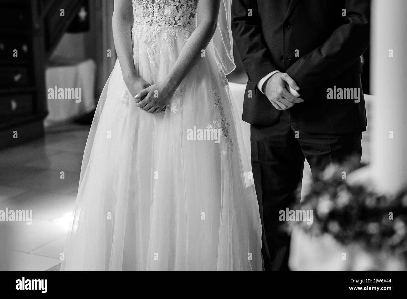 Bride and groom standing next to each other, hands close-up Stock Photo ...