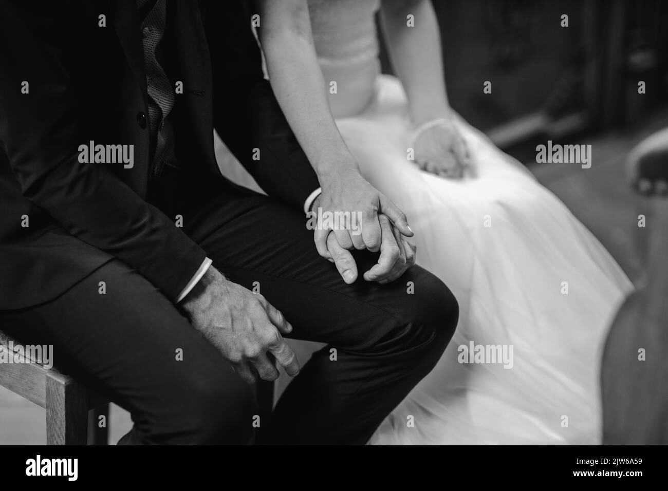 Bride and Groom holding hands during their wedding ceremony Stock Photo ...