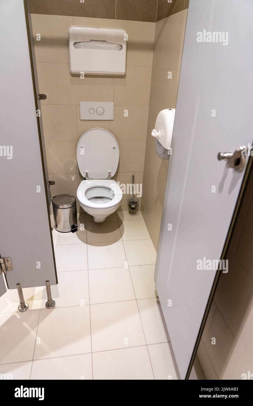 Classic toilet cubicle with open door in a public restroom Stock Photo ...