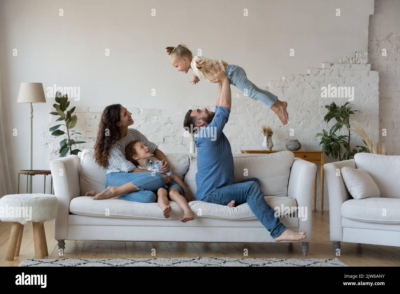 Full family with little kids spend playtime at home Stock Photo - Alamy