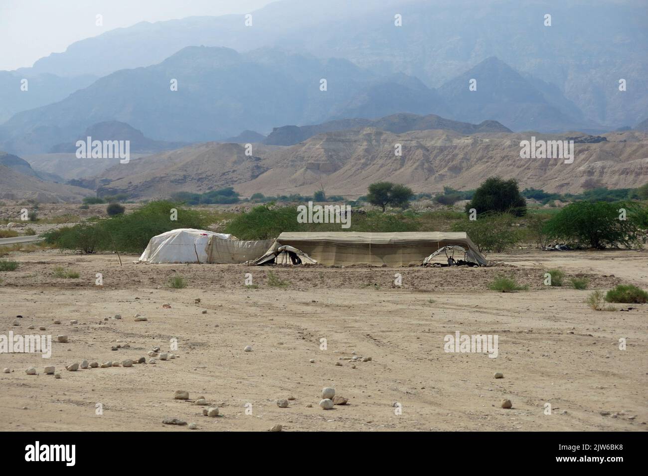 landscape of a nomad camp in the desert in the middle east without ...