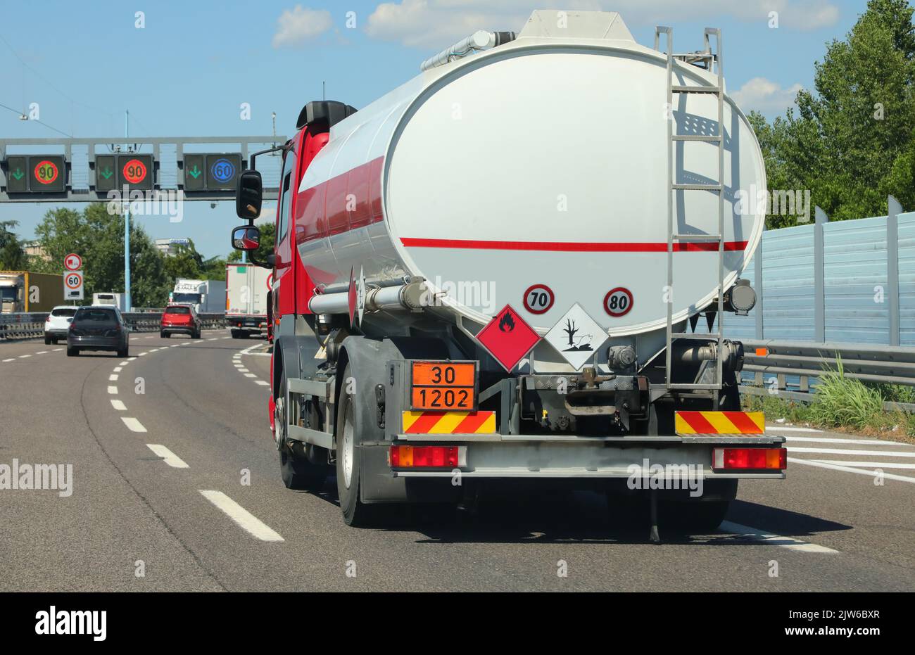 large tanker truck in the busy street for transporting flammable ...