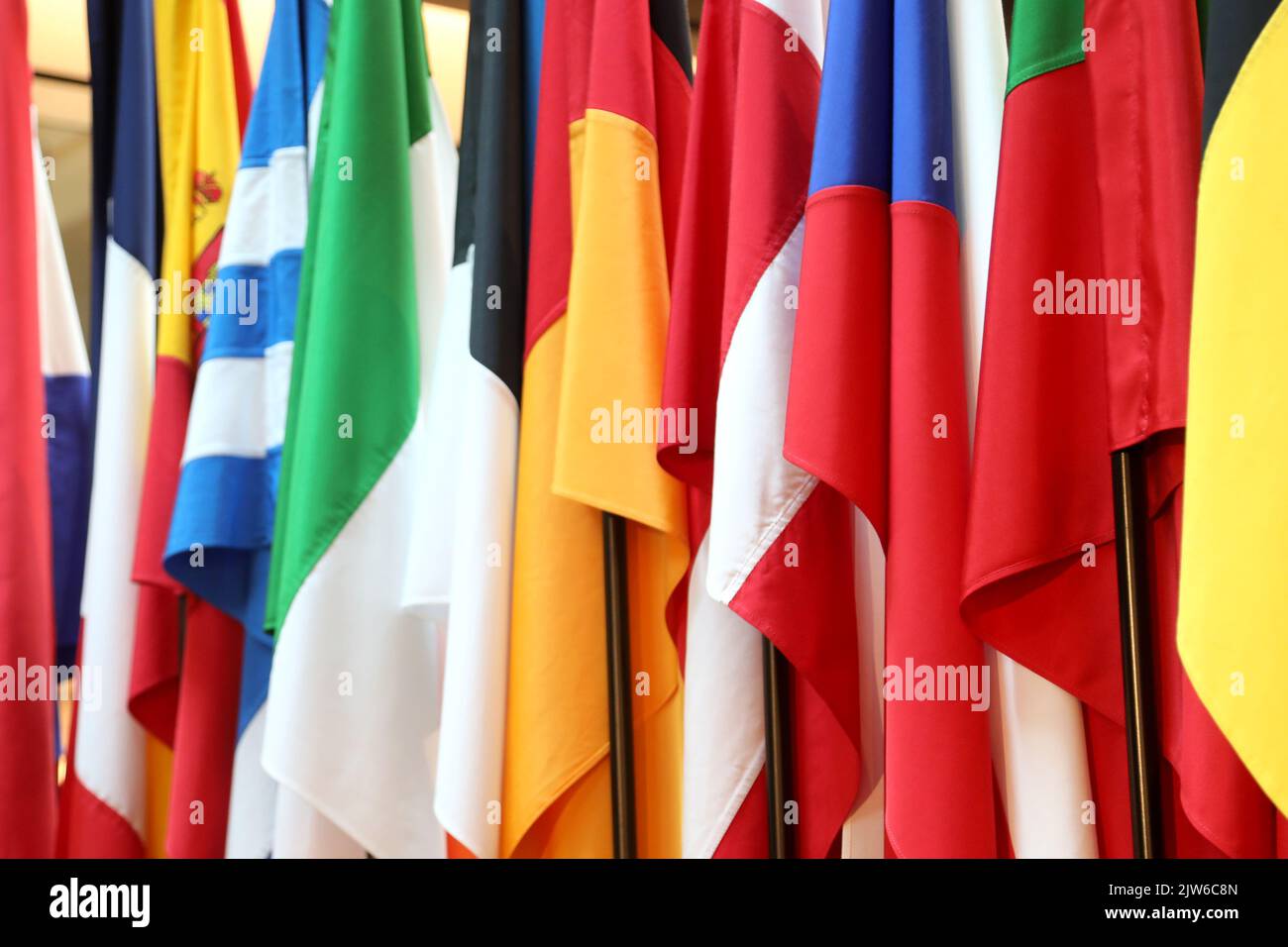 background with many international flags of many nations and different ...