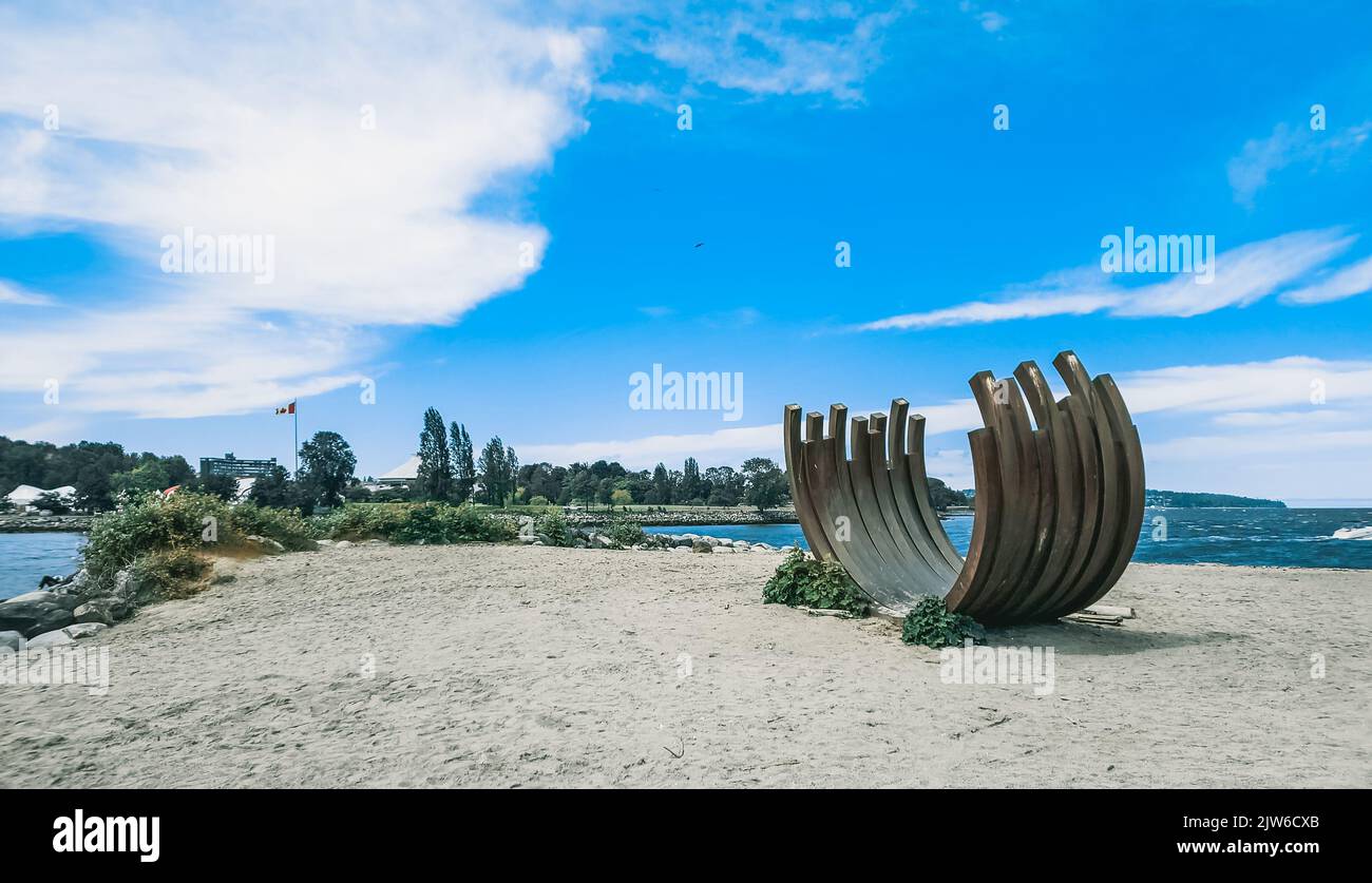 An old corten steel arc sculpture on the beach in Vancouver, Canada, in ...