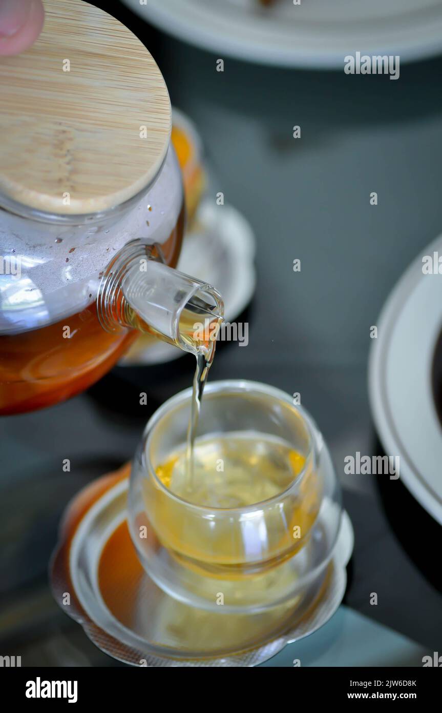 Handing cup of tea hi-res stock photography and images - Alamy