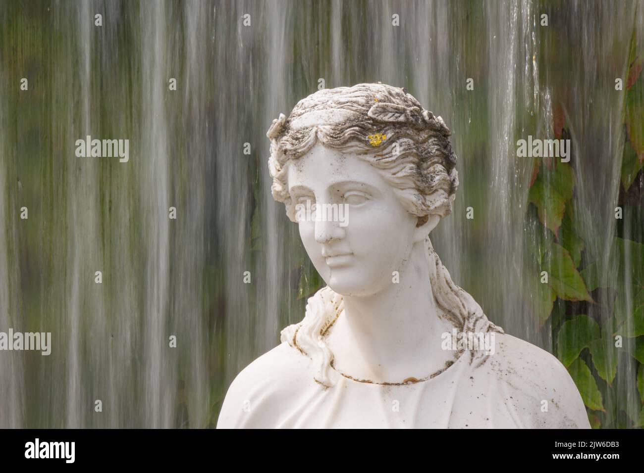 A beautiful view of a stone lady sculpture on the background of a ...