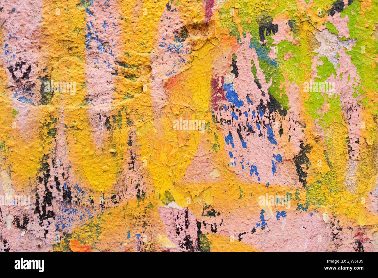 Wall with old peeling paint and plaster. Urban, street, colorful abstract background. High ...