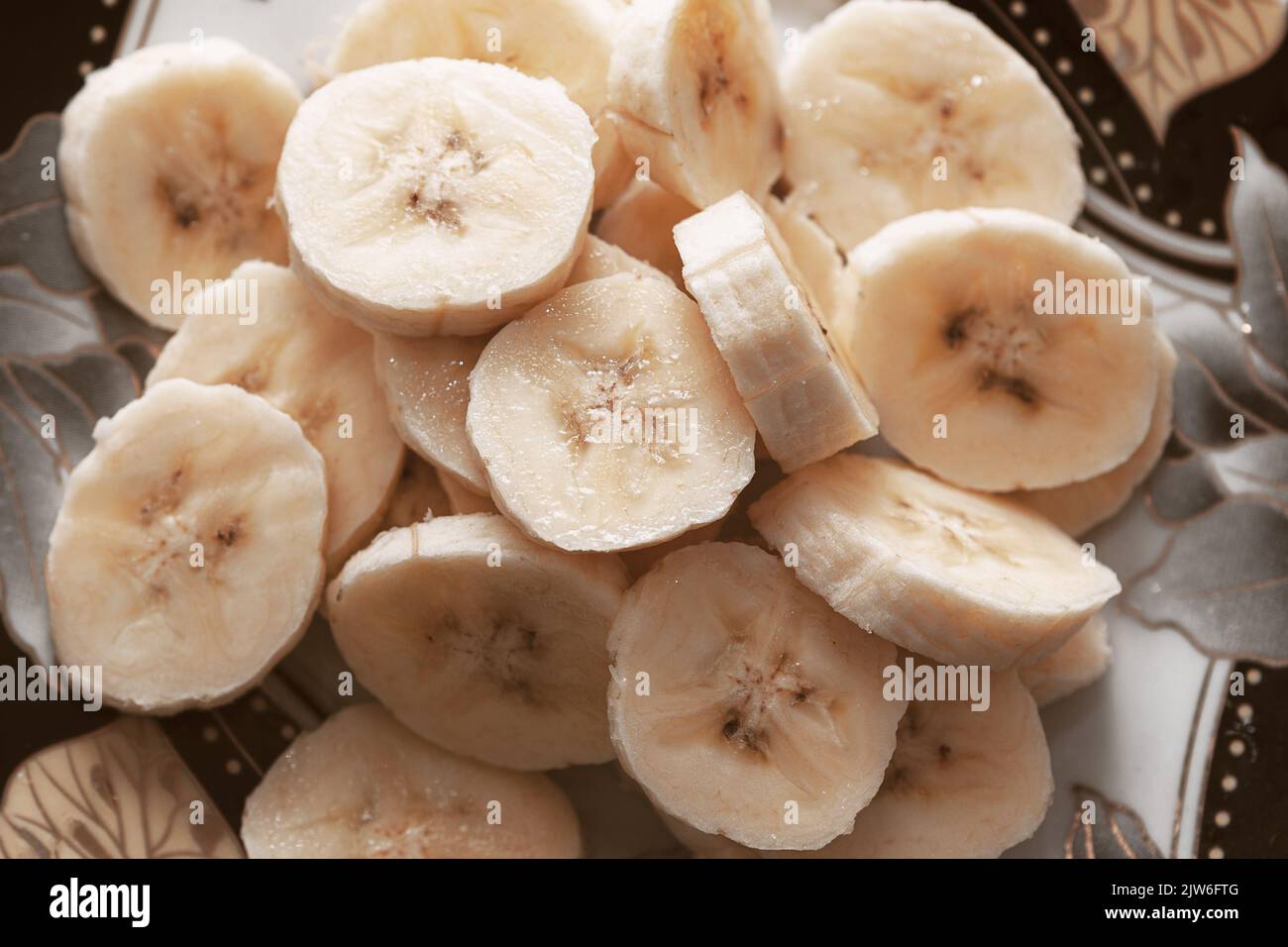 Chopped bananas in plate . Healthy exotic fruit Stock Photo - Alamy