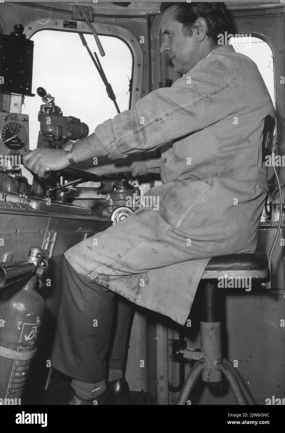 Image of a technician in the operator cabin of an electric locomotive ...