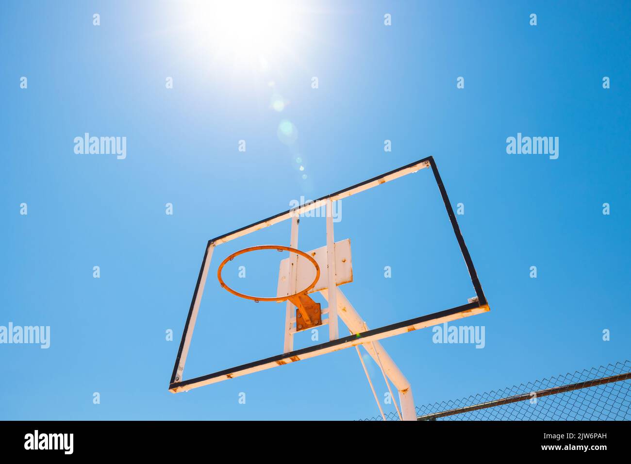 Broken backboard of basketball field in the park. Abandoned town ...