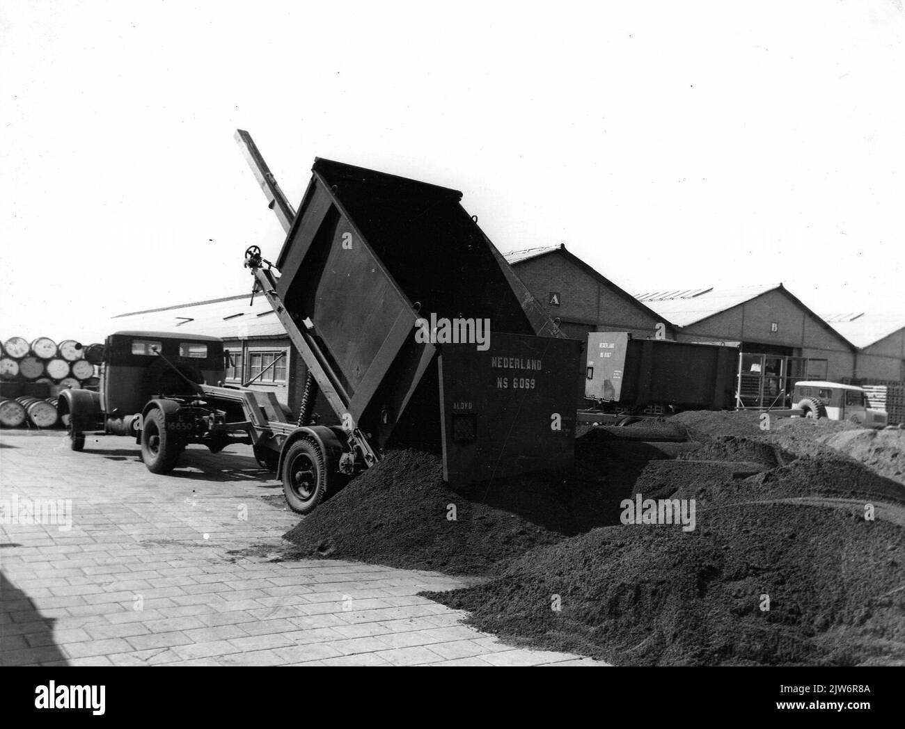 Image of a truck while unloading a coal drawer of the N.S. With coal ...