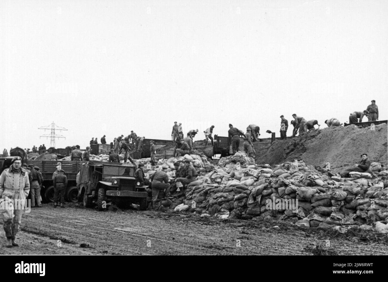 Image of filling sandbags for the recovery of the railway line through ...