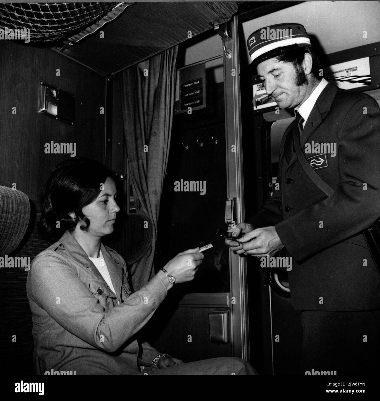 Image of a conductor during the map check Stock Photo - Alamy