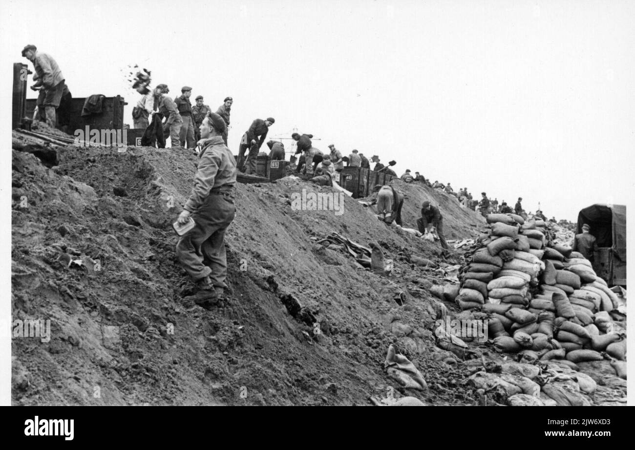 Image of filling sandbags for the recovery of the railway line through ...