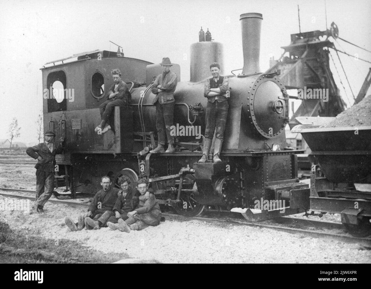 Image of a group of workmen of a sand excavation at a steam locomotive ...